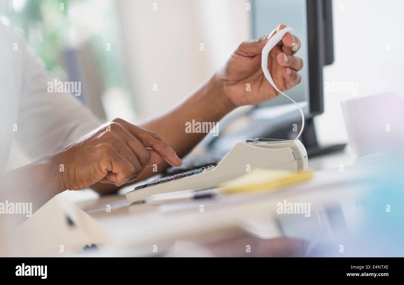Business man hand holding calculator hi-res stock photography and ...