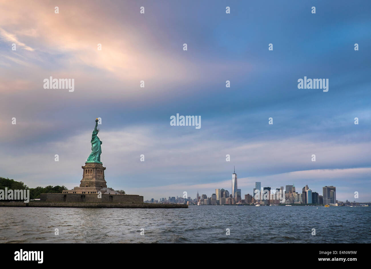 USA, New York, New York City, Statue of Liberty with city skyline in ...