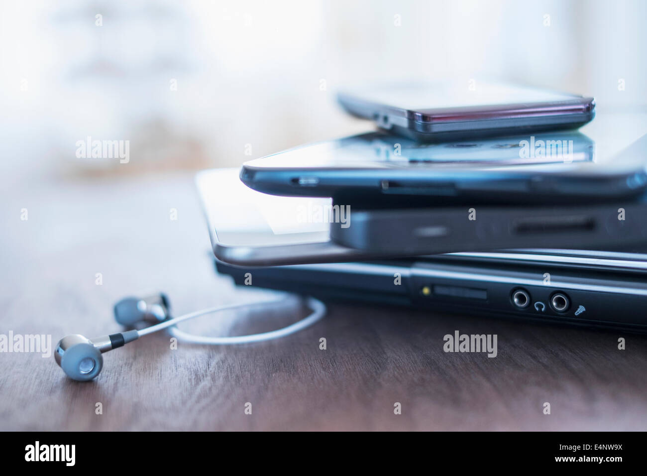 Close up of stack of devices on desk Stock Photo - Alamy