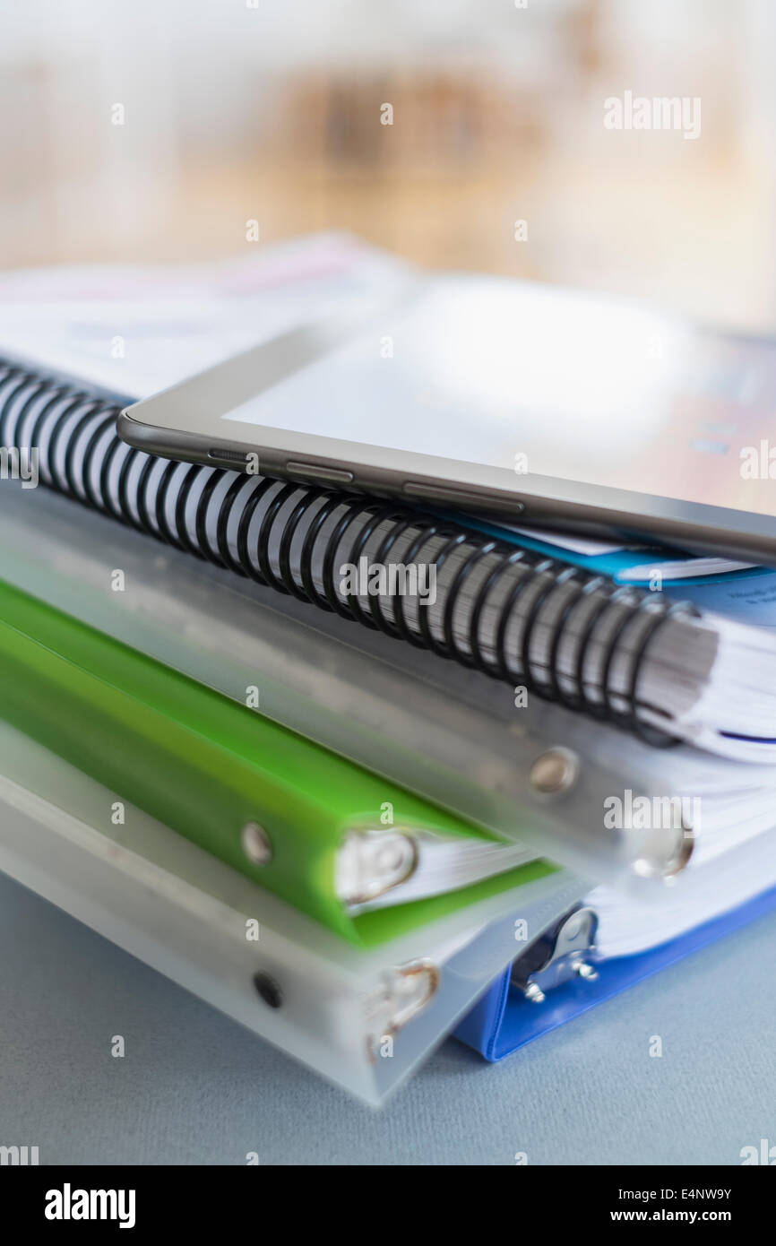 Close up of stack of notebooks with digital tablet on top Stock Photo ...