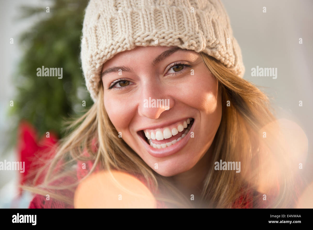 Portrait of young woman wearing knit hat Stock Photo - Alamy