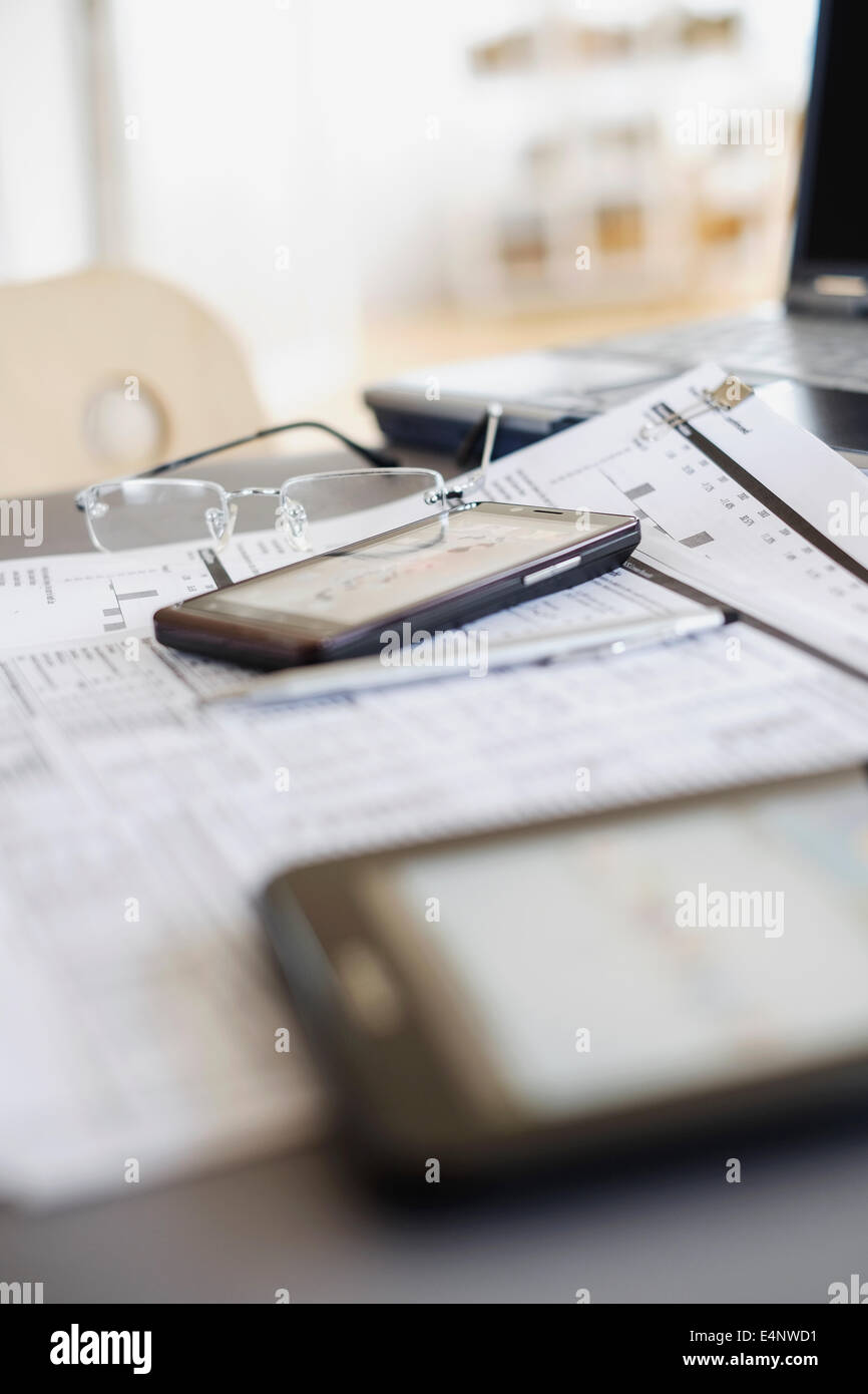Close up of glasses on paperwork Stock Photo - Alamy