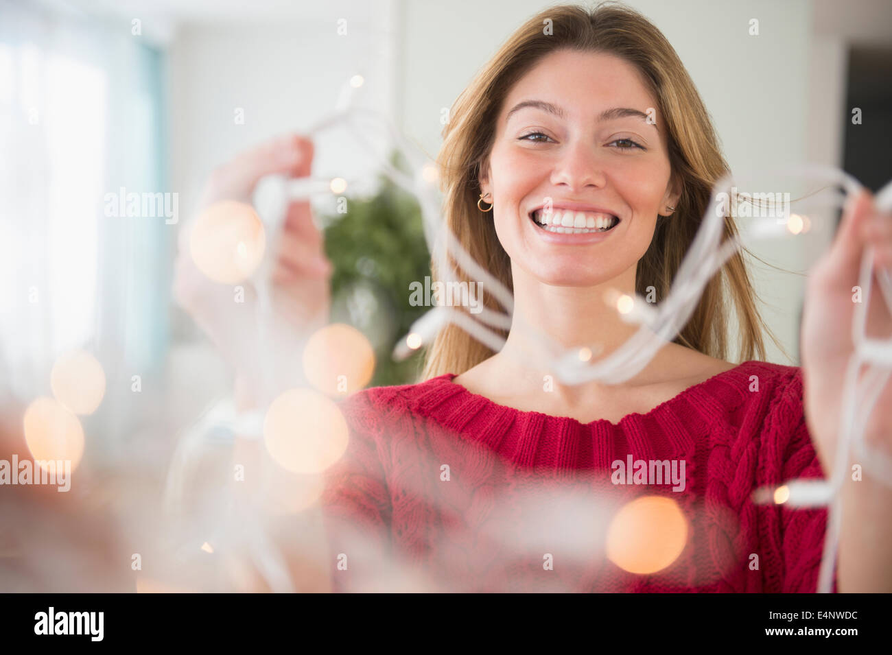 Young woman holding ribbons Stock Photo - Alamy