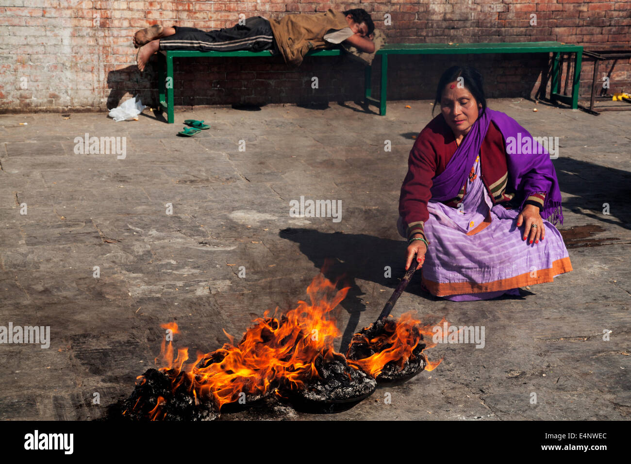 Lady burning pots at Swayambhunath Stupa, Monkey Temple, Kathmandu ...