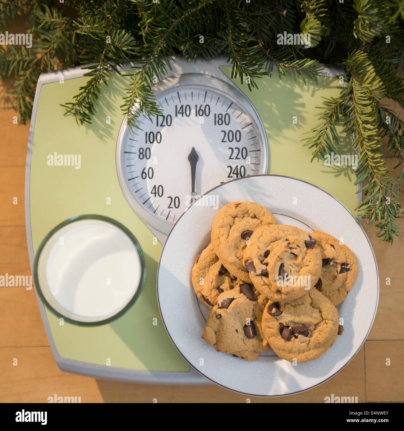 Studio Shot of cookies and milk on bathroom scale Stock Photo - Alamy