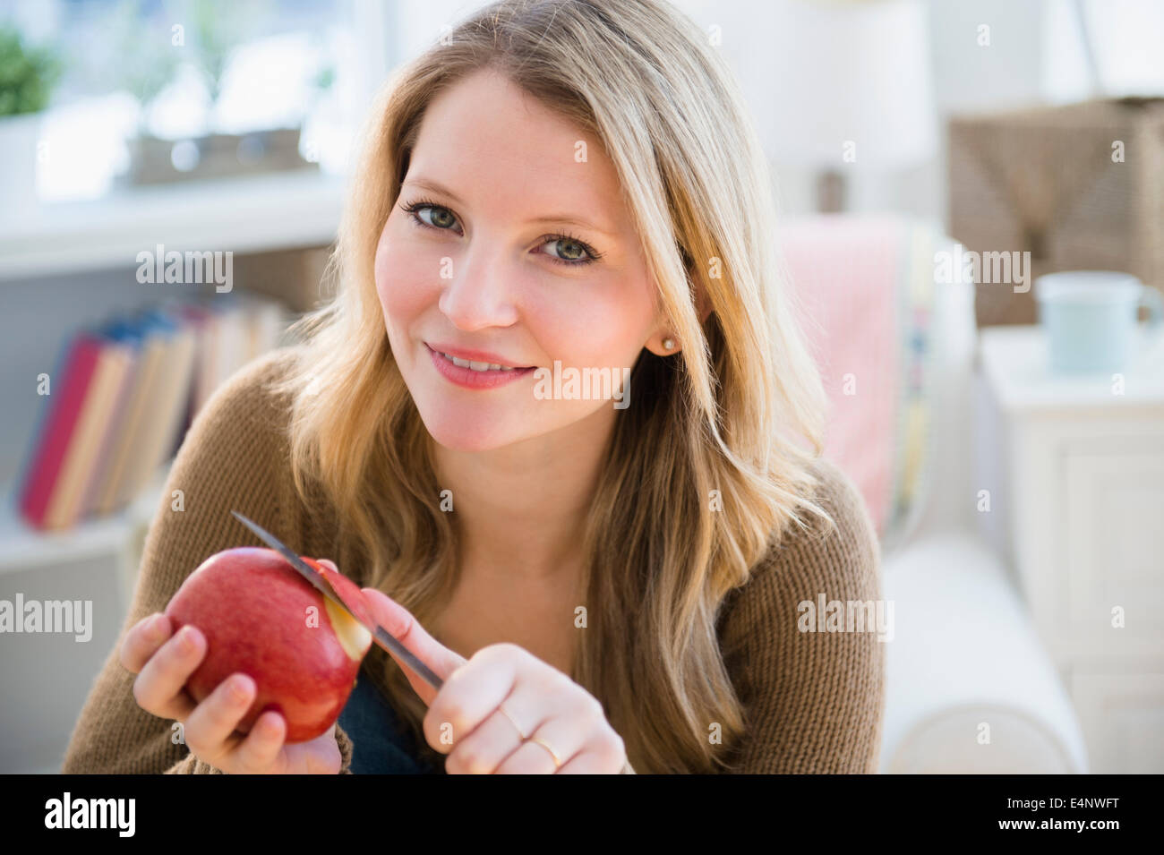 Woman peeling apple Stock Photo - Alamy