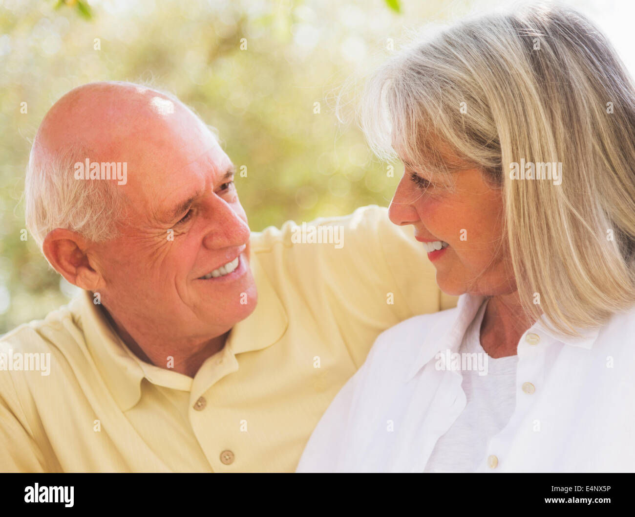 Senior couple smiling to each other Stock Photo - Alamy