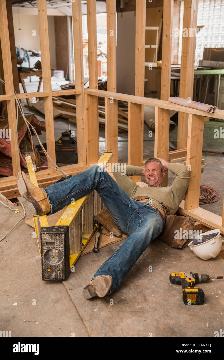Construction worker falling of ladder inside new structure Stock Photo ...