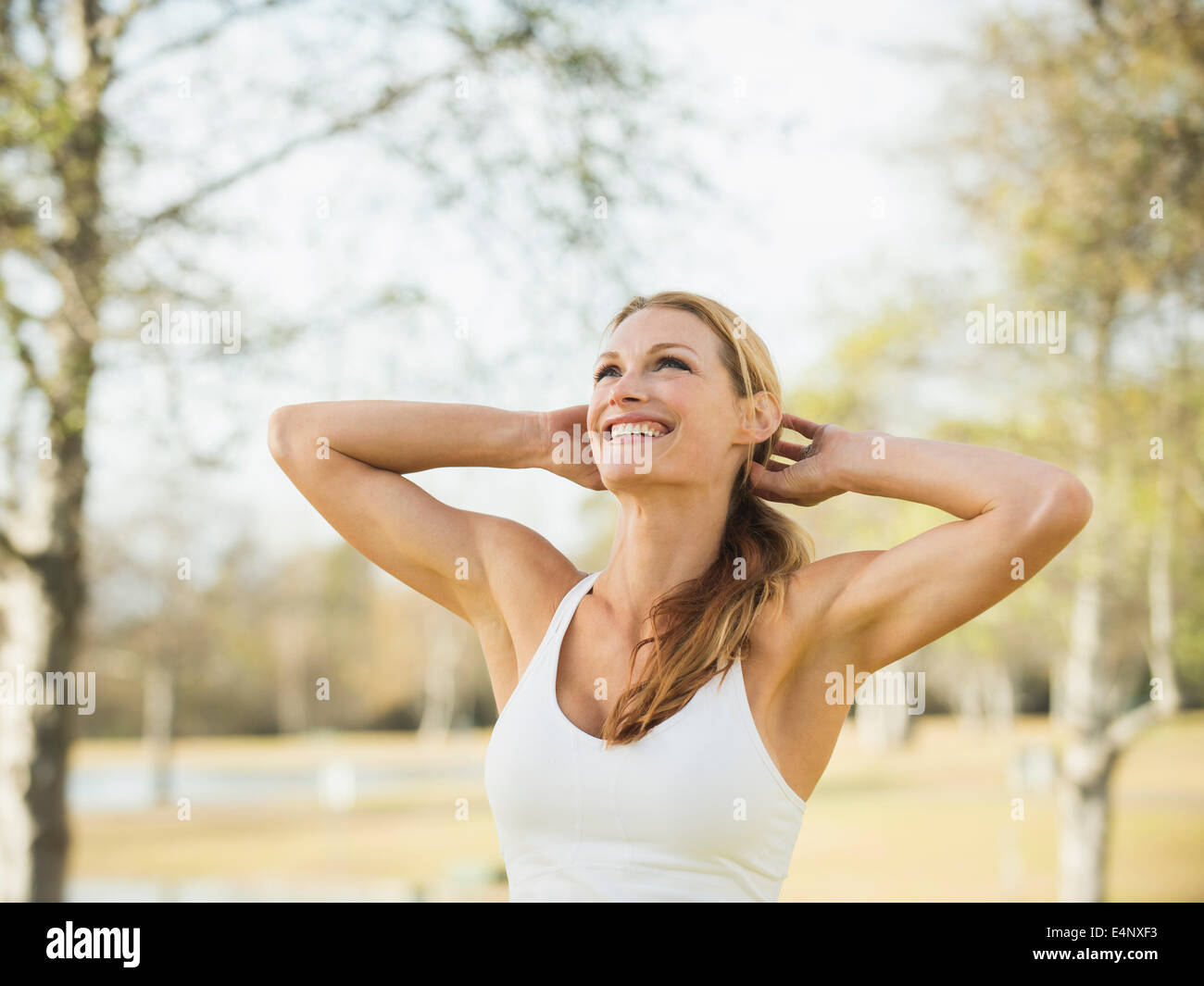 USA, California, Irvine, Woman smiling and looking up Stock Photo - Alamy