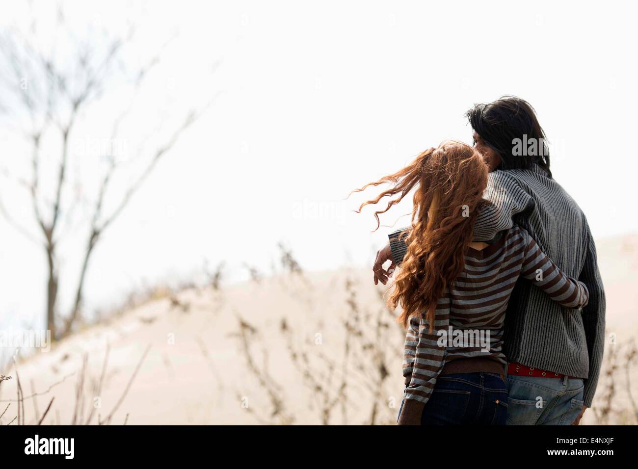Couple embracing outdoors Stock Photo - Alamy