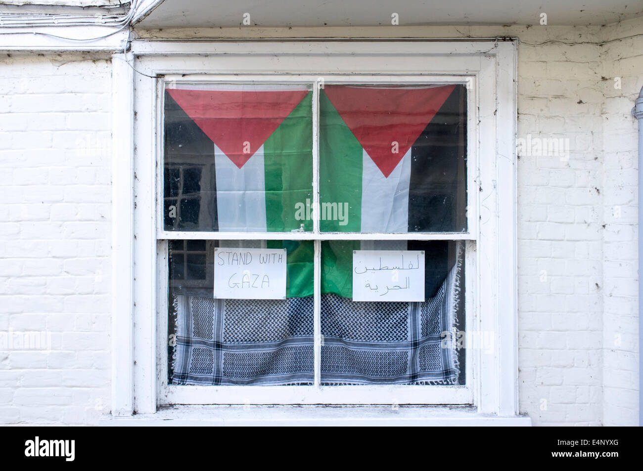Flag of Palestine hanging in UK window with hand written notice in ...