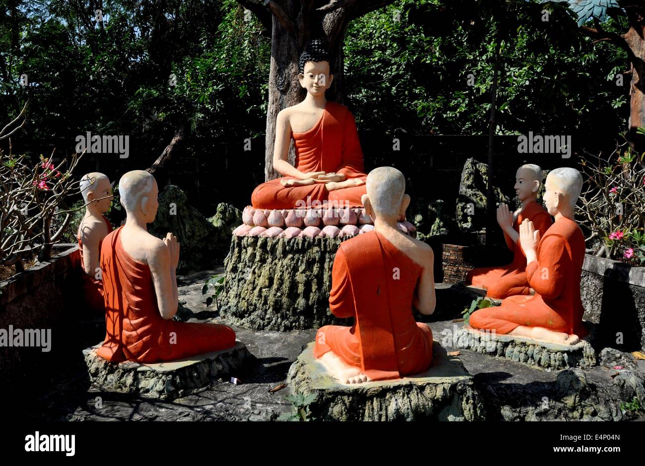 Bang Saen, Thailand: A group of seated monk figures in the gardens at ...