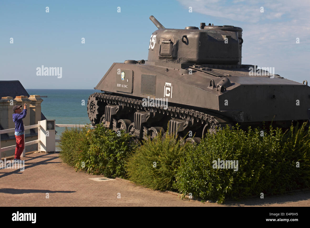 Boy taking photo of French 2nd DB Sherman tank Berry Au Bac on display ...