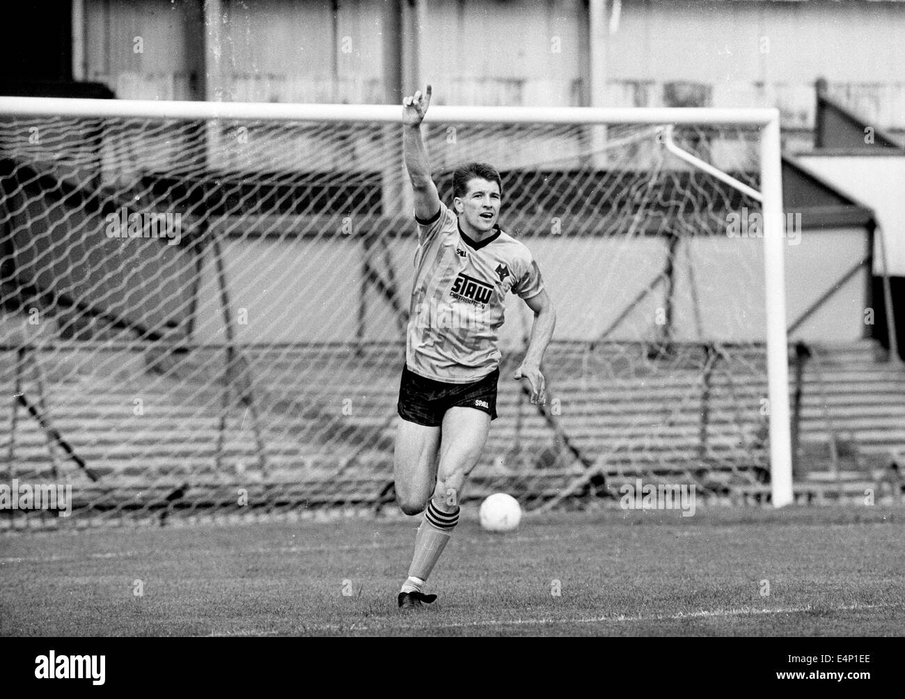 Footballer Steve Bull celebrating his goal in the old rundown Molineux ...