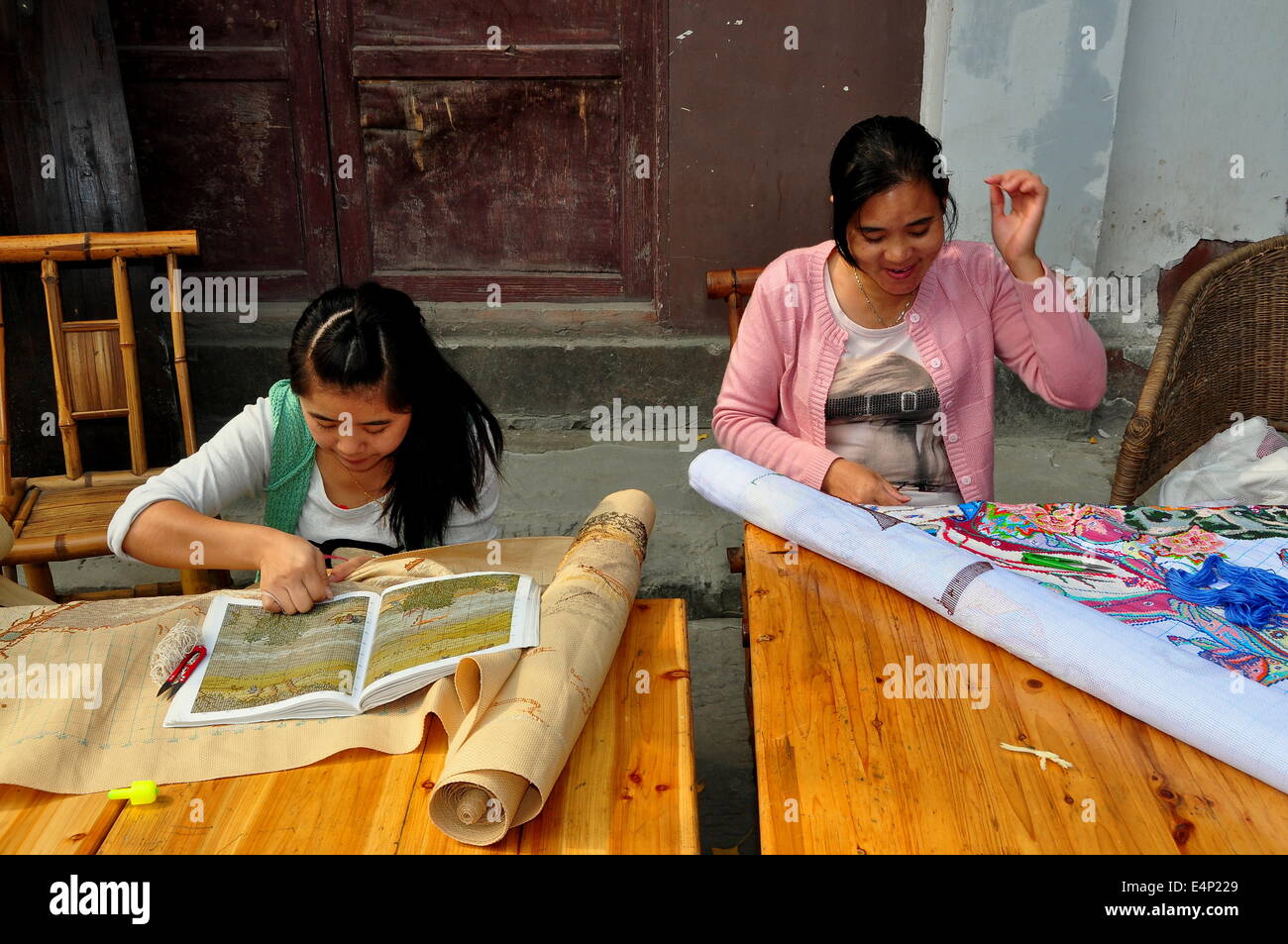 LANGZHONG ANCIENT CITY (SICHUAN), CHINA: Two young Chinese women doing ...