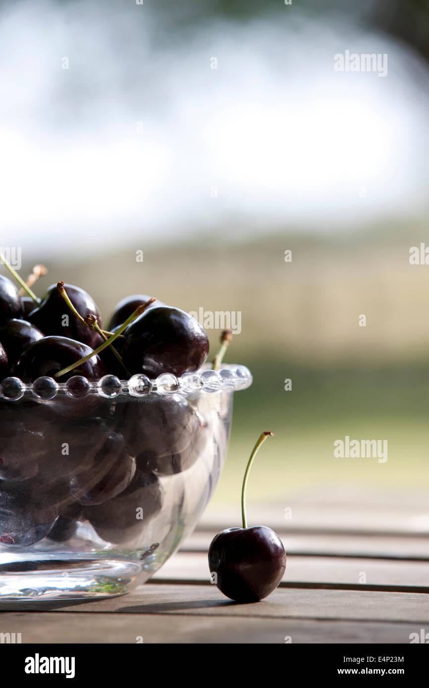Black cherries in a glass bowl, cropped Stock Photo - Alamy