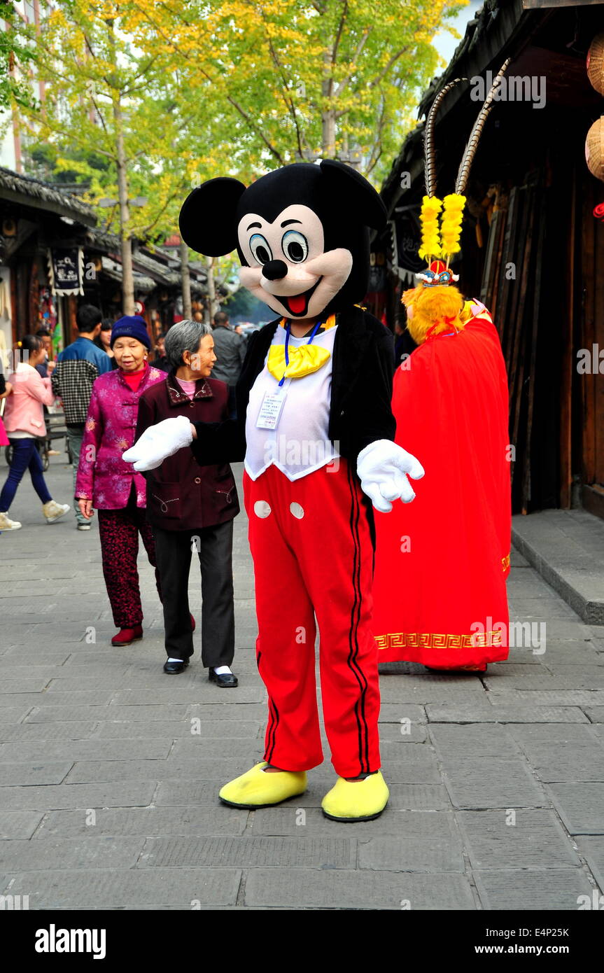 LANGZHONG ANCIENT CITY (SICHUAN), CHINA: A Mickey Mouse actor adds a ...