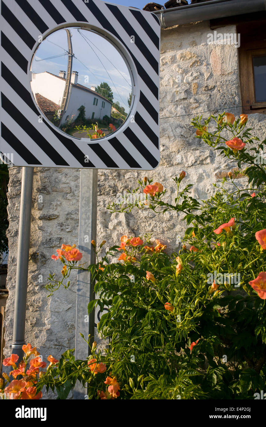 Traffic junction mirror to help locals with tight corners, in Langlade ...