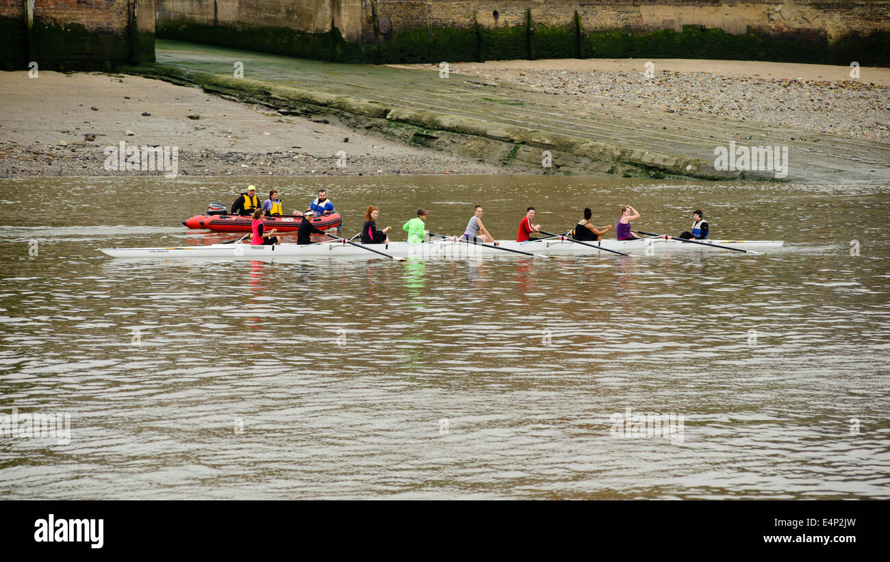 A stern coxed 8 rowing skiff practicing on the River Thames Stock Photo ...