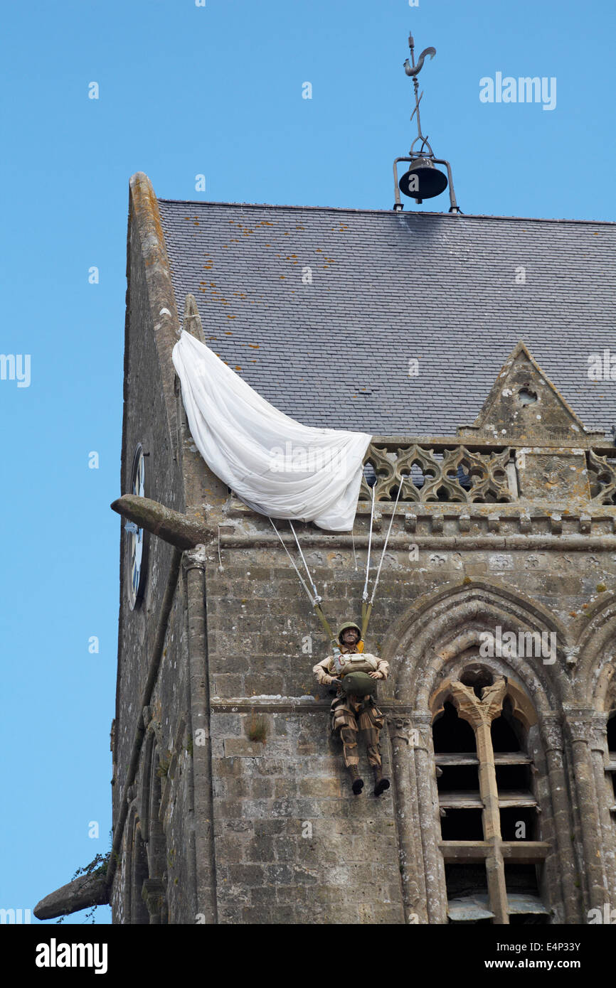 dummy paratrooper hangs from the church spire, commemorating the story ...
