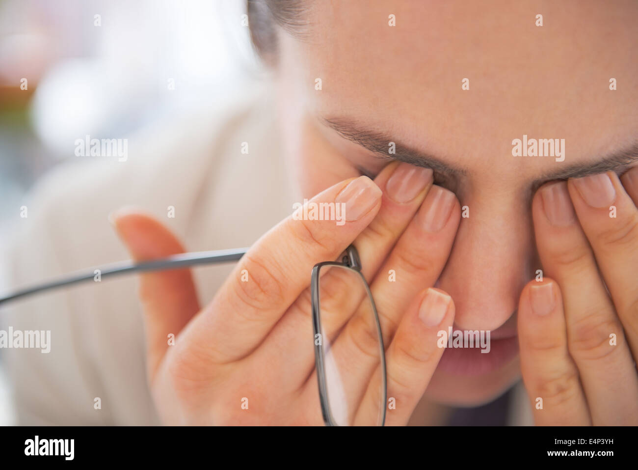 Closeup on tired business woman with eyeglasses Stock Photo - Alamy