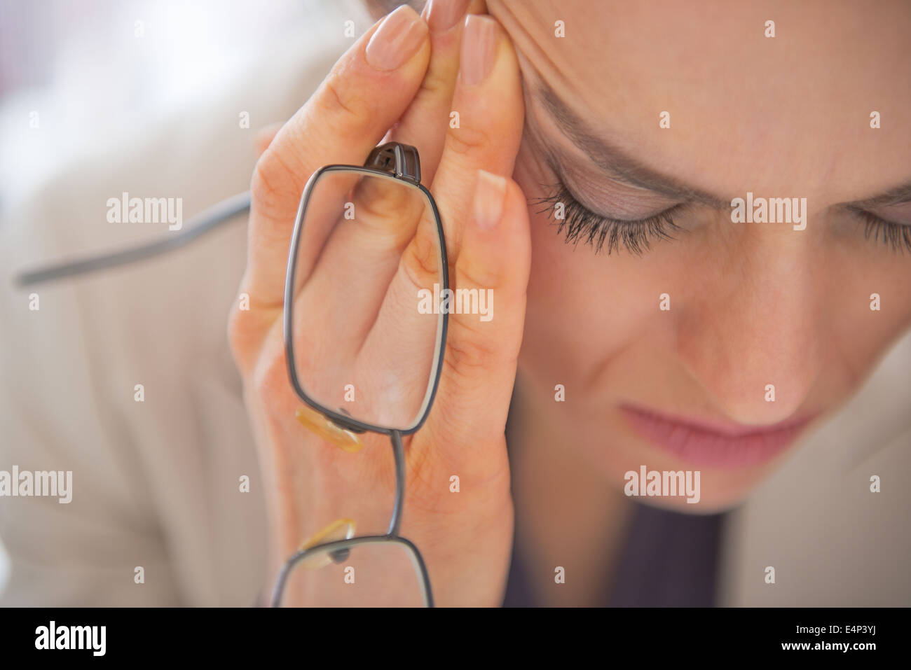 Closeup on stressed business woman with eyeglasses Stock Photo - Alamy