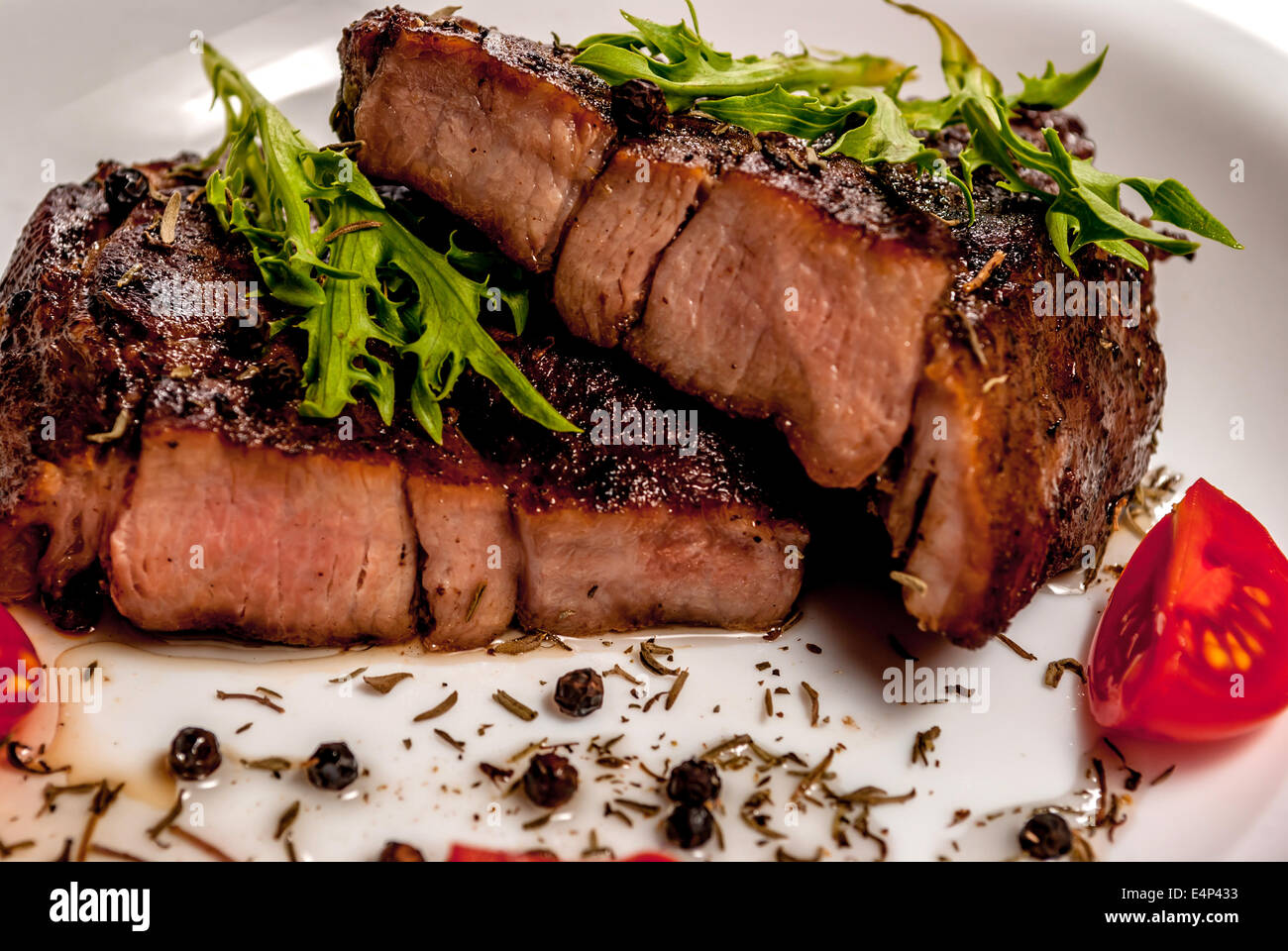 Pork neck steak with vegetables and pepper Stock Photo - Alamy
