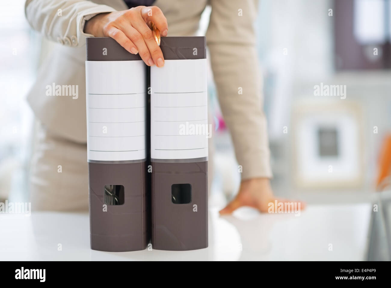 Closeup on business woman with folders Stock Photo - Alamy