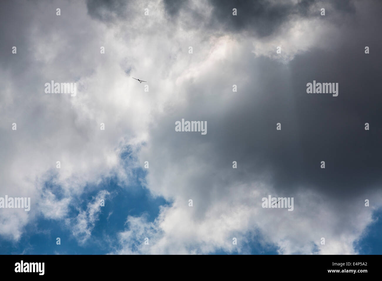Glider before dark storm clouds in the sky Stock Photo - Alamy