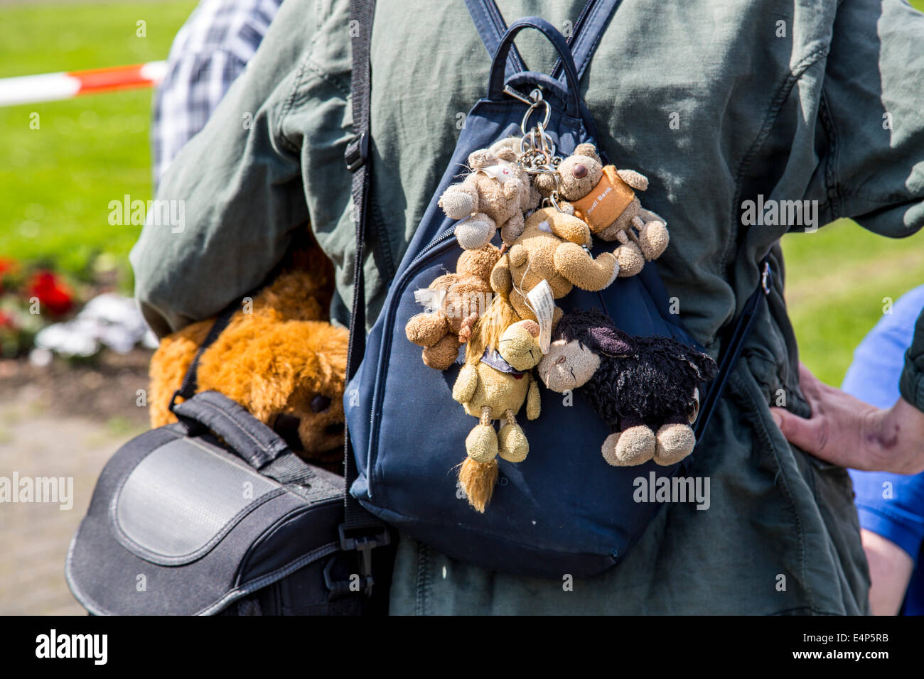 Woman with many soft toy keychain on a backpack Stock Photo - Alamy