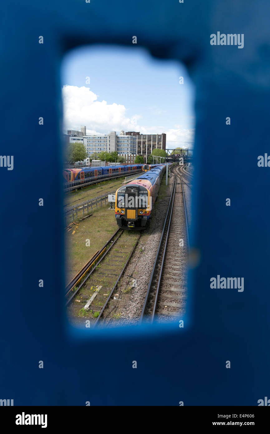 View of train through railway bridge Stock Photo - Alamy