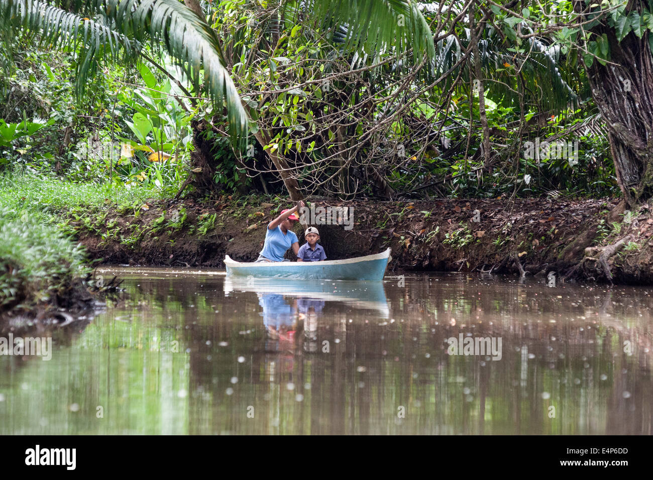 Woman with her child rowing in Isla Colon Bocas del Toro Stock Photo ...