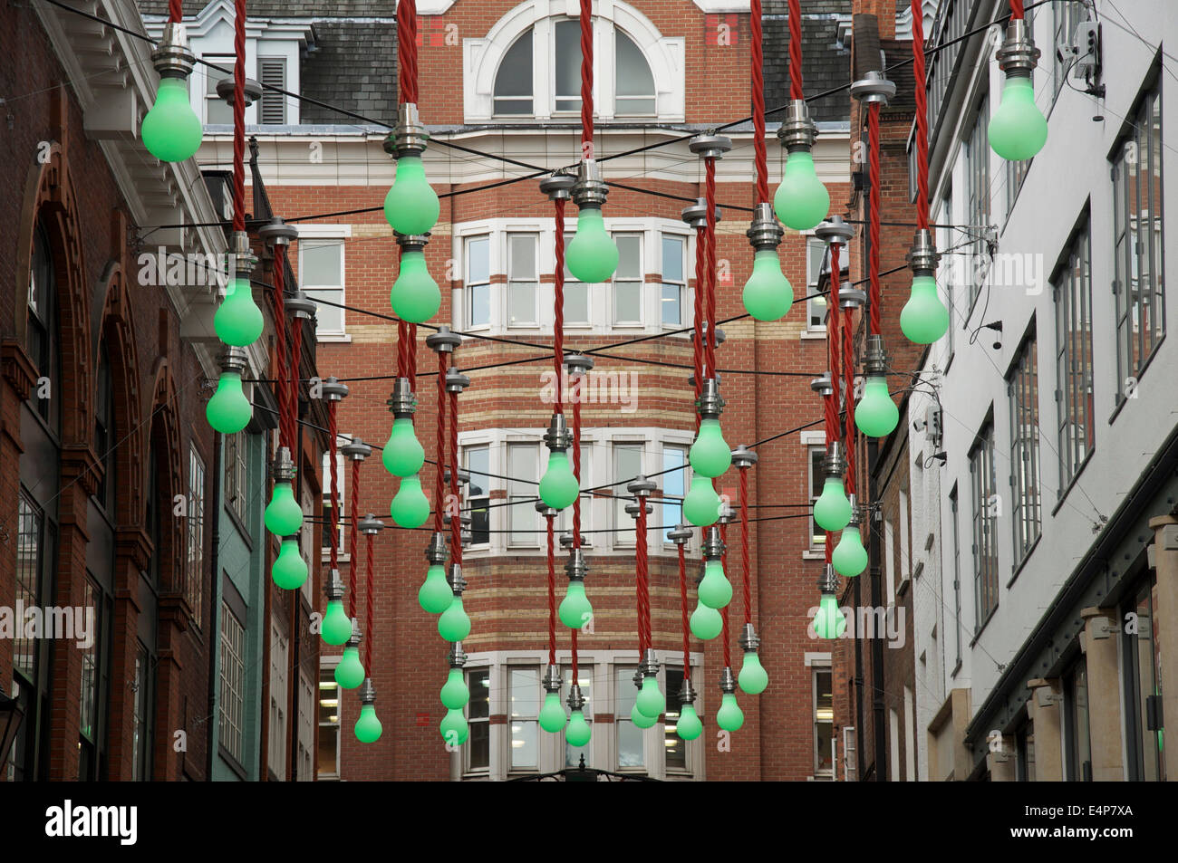 A decorative display of large light bulbs dangling above the ...