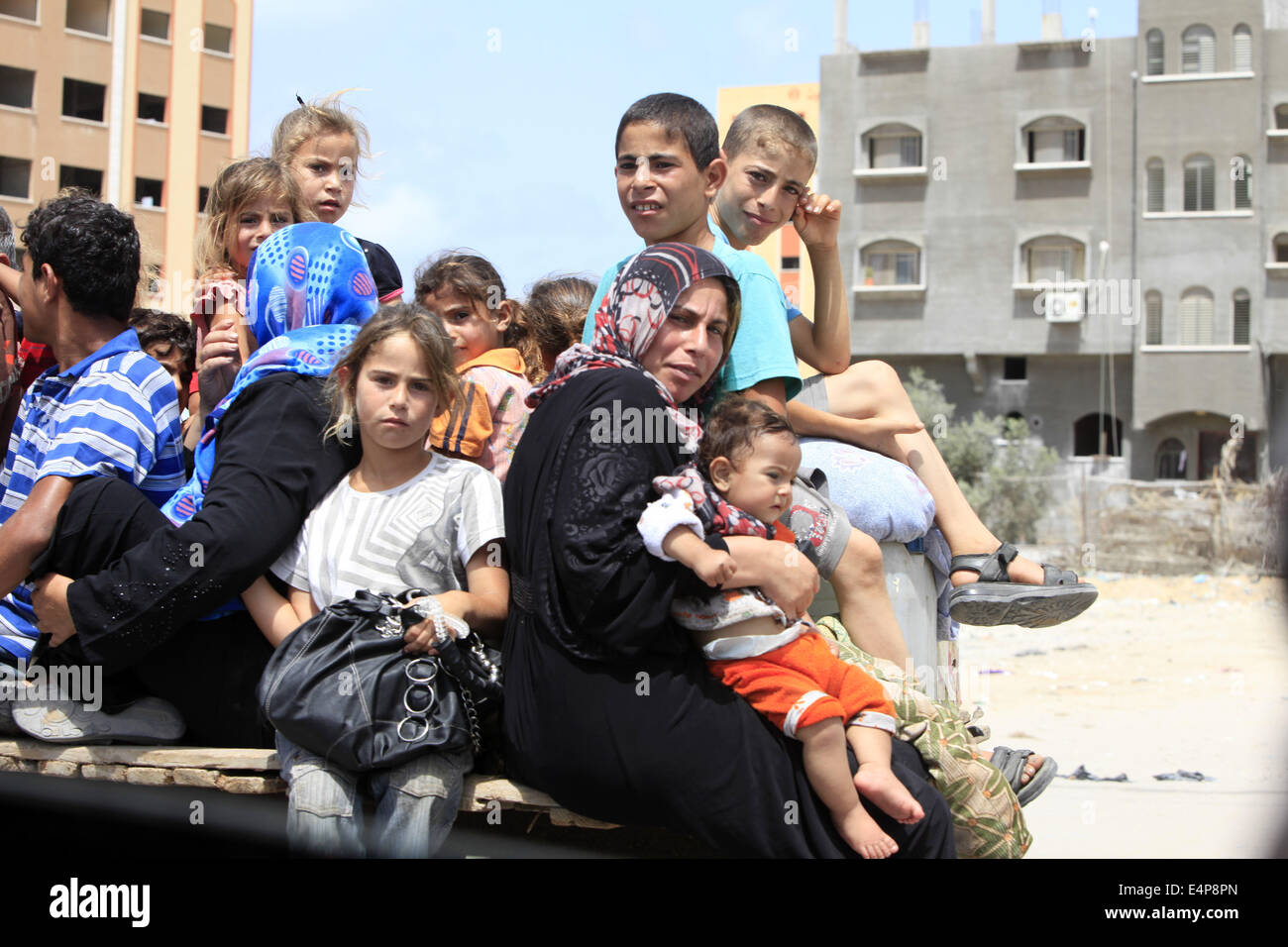 Beit Lahia, Gaza Strip. 13th July, 2014. Palestinians evacuate the ...