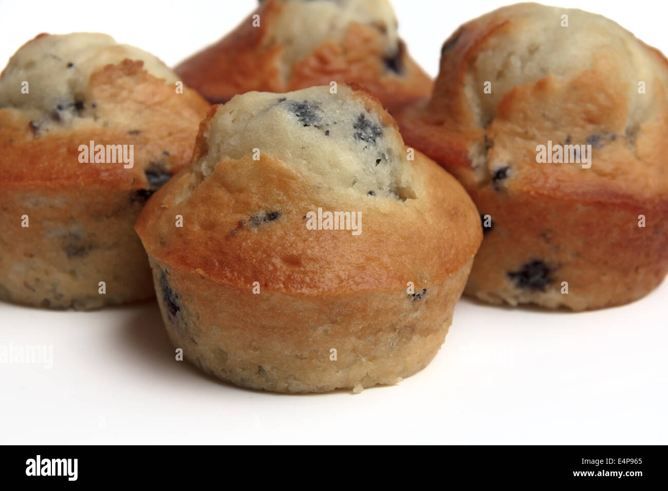 Close-up of blueberry muffin isolated on white Stock Photo - Alamy