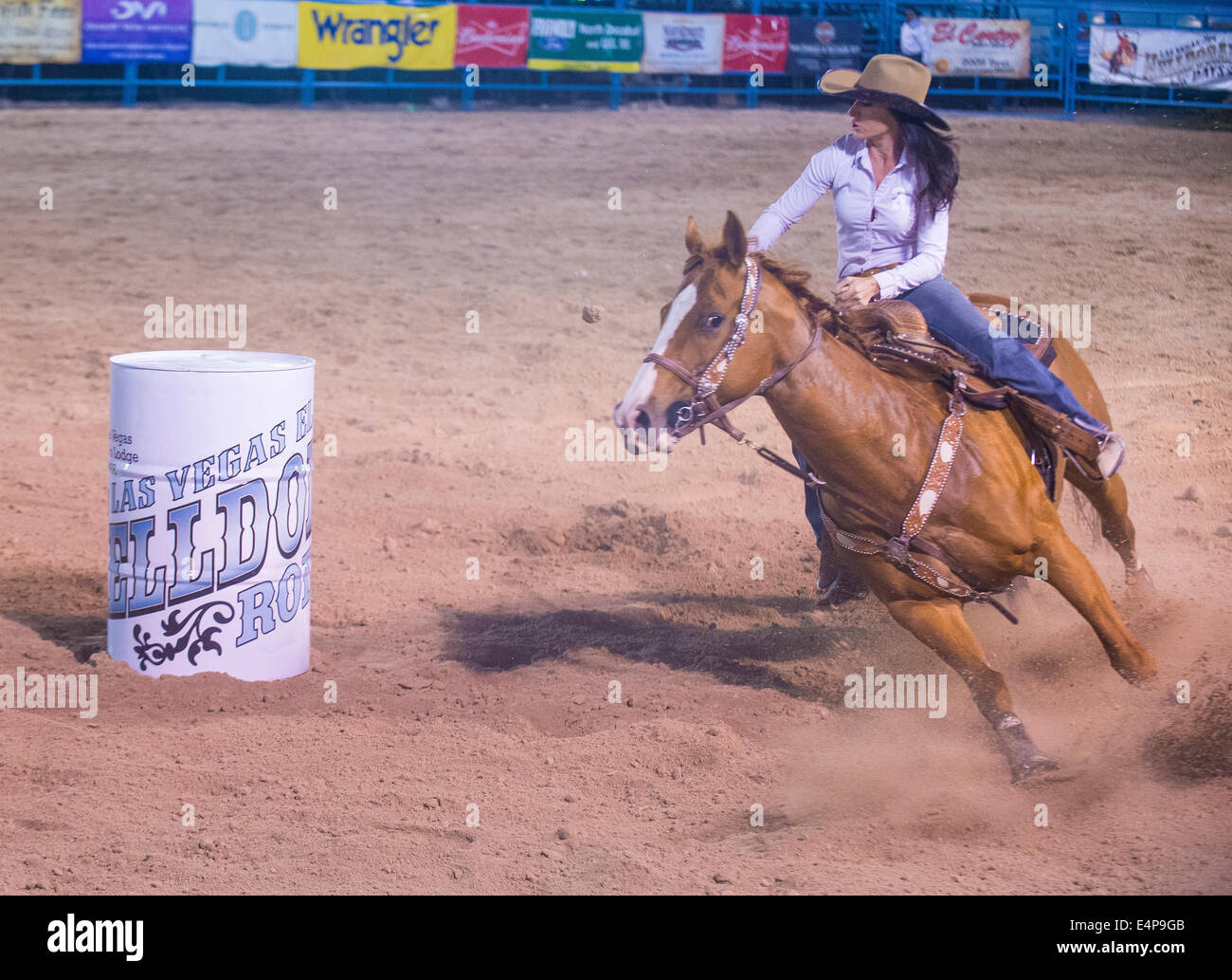 Cowgirl Participating in a Barrel racing competition at the Helldorado ...