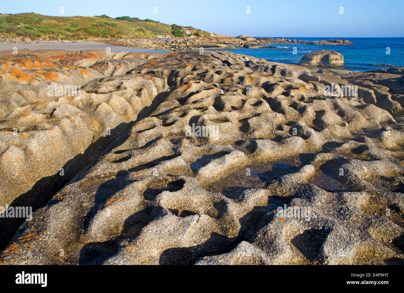 Granite formations along the coast of Three Hummock Island Stock Photo ...