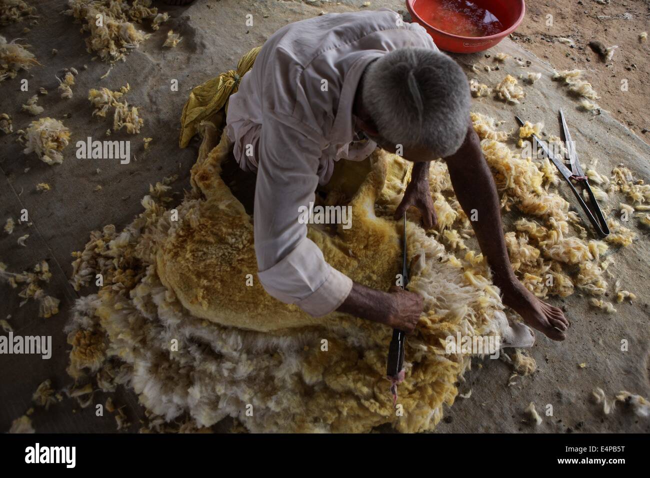 Rajasthan, Rajasthan of India. 15th July, 2014. A worker shaves the ...
