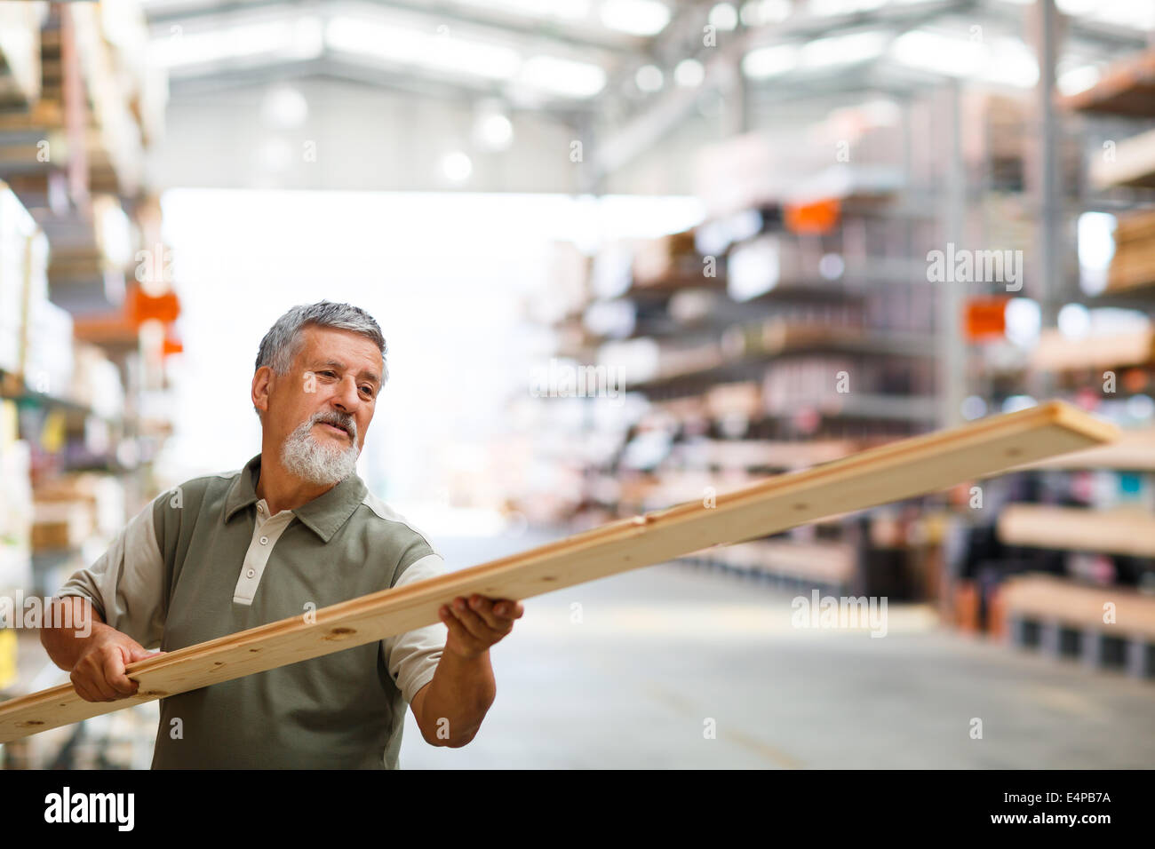 Man choosing and buying construction wood in a DIY store for his DIY ...