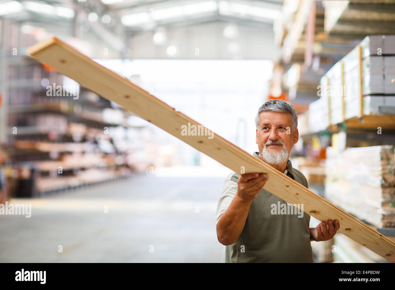 Man choosing and buying construction wood in a DIY store for his DIY ...
