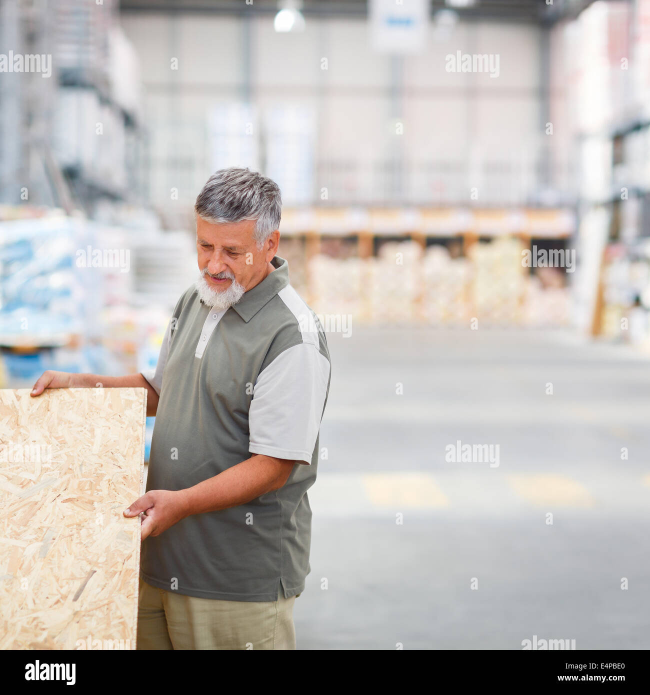 Man choosing and buying construction wood in a DIY store for his DIY ...