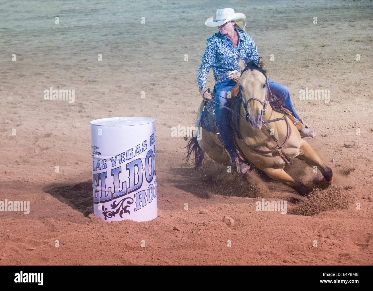 Cowgirl Participating in a Barrel racing competition at the Helldorado ...