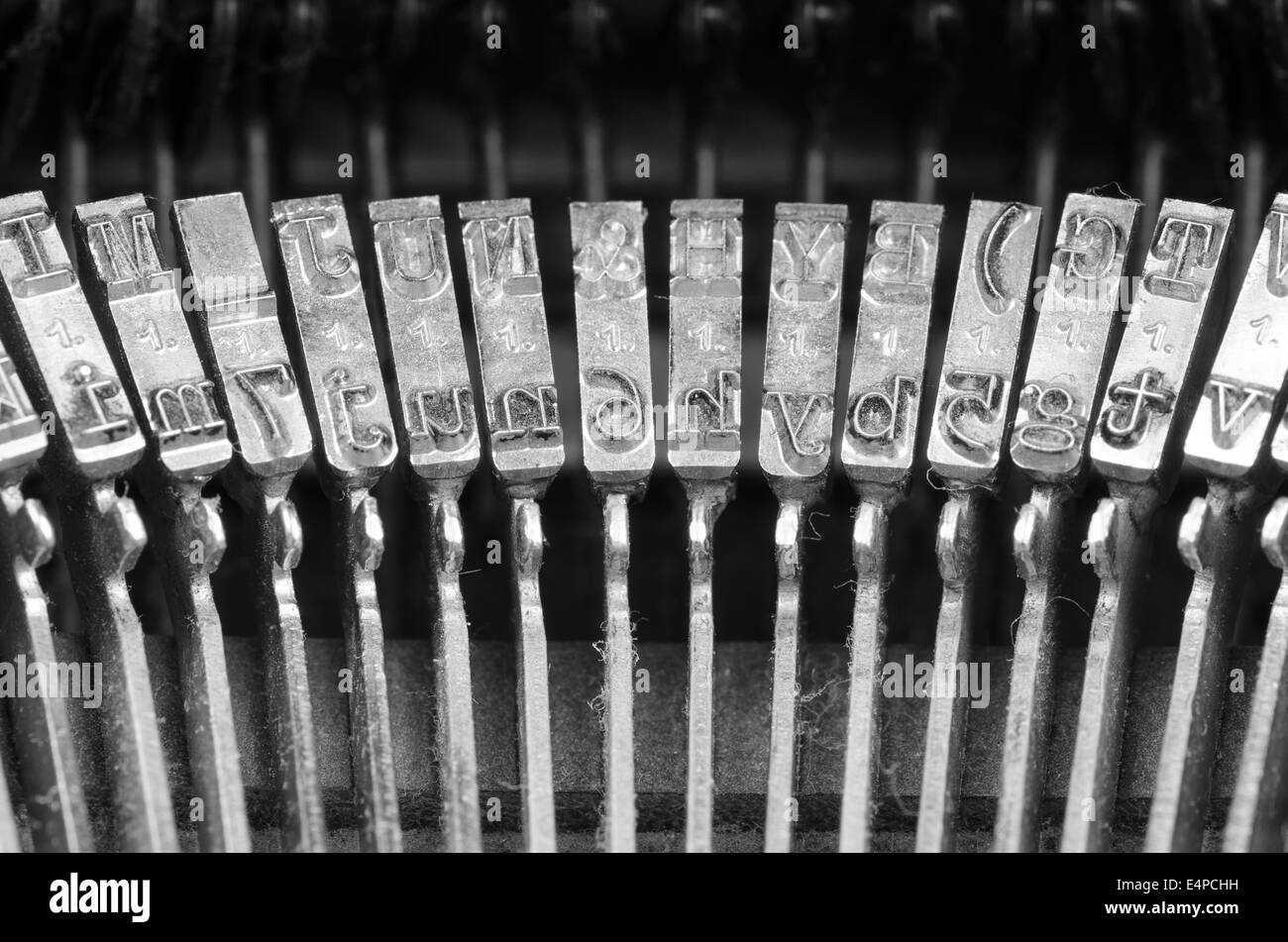 Closeup take of an old typewriter mechanism with its set of keys and ...