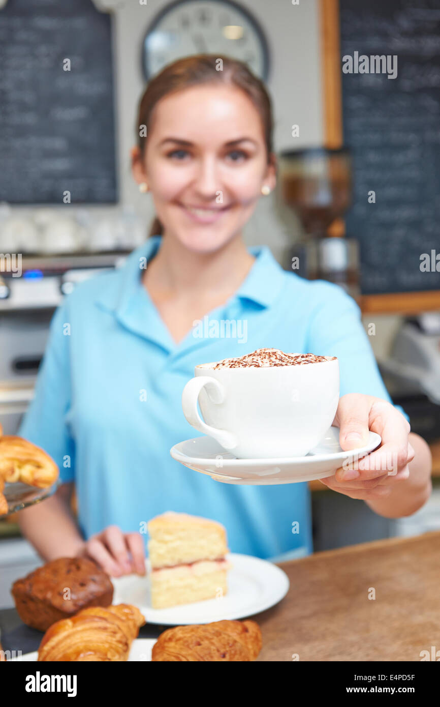 Waitress In Cafe Serving Customer With Coffee Stock Photo - Alamy