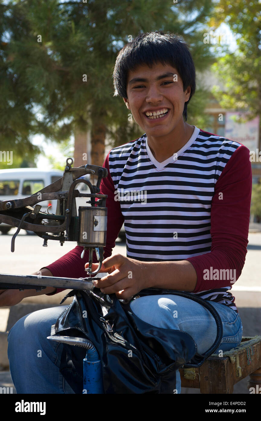 Man working on a sewing machine by the roadside, Shakhrisabz, Shar-e ...