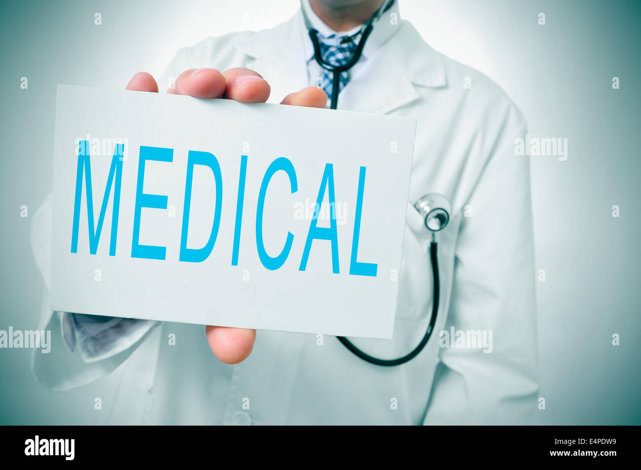 a doctor showing a signboard with the word medical written in it Stock ...