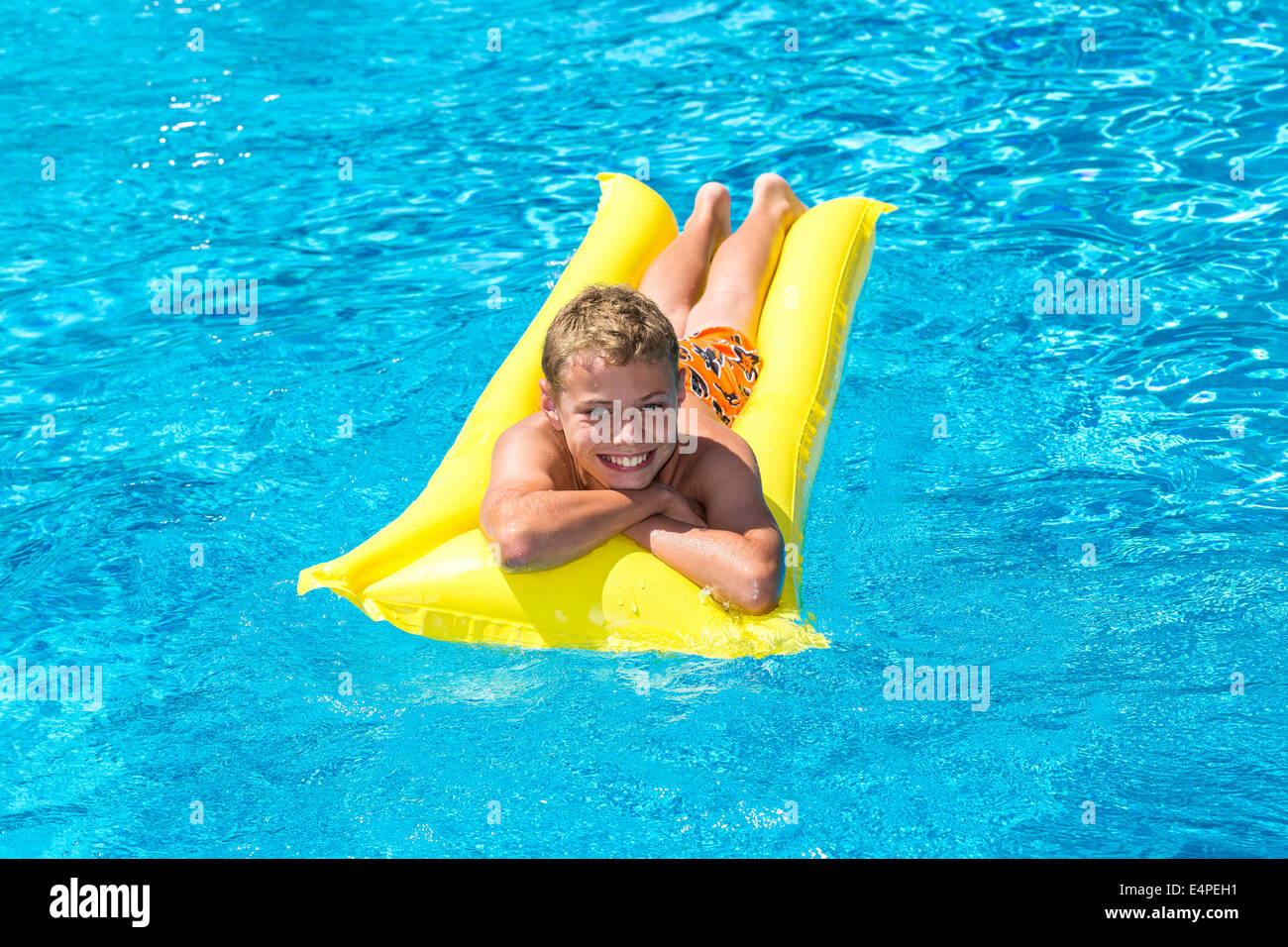 Boys Lying Pool High Resolution Stock Photography and Images - Alamy