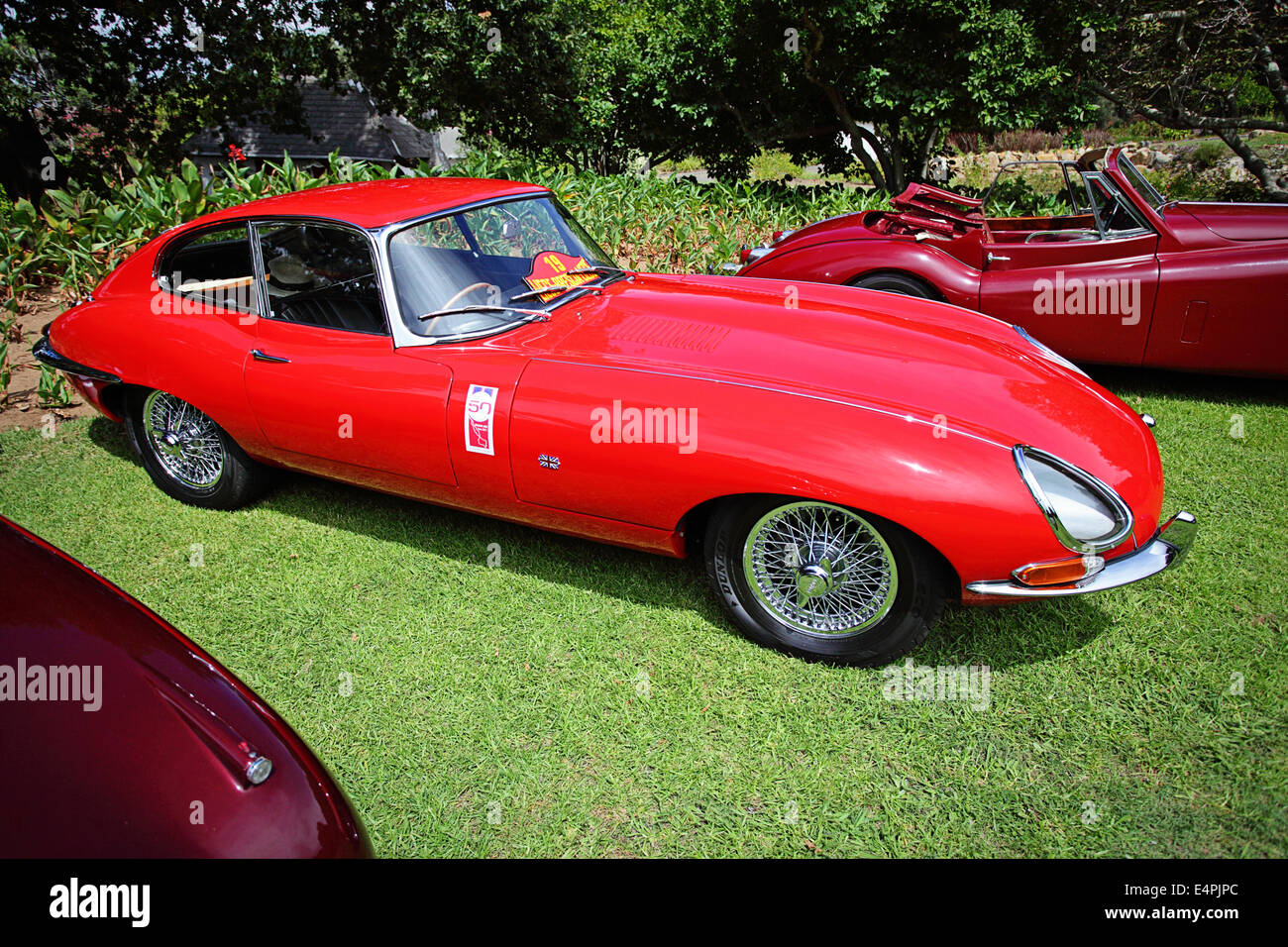 shiny red Jaguar E-Type (a.k.a. Jaguar XK-E Stock Photo - Alamy