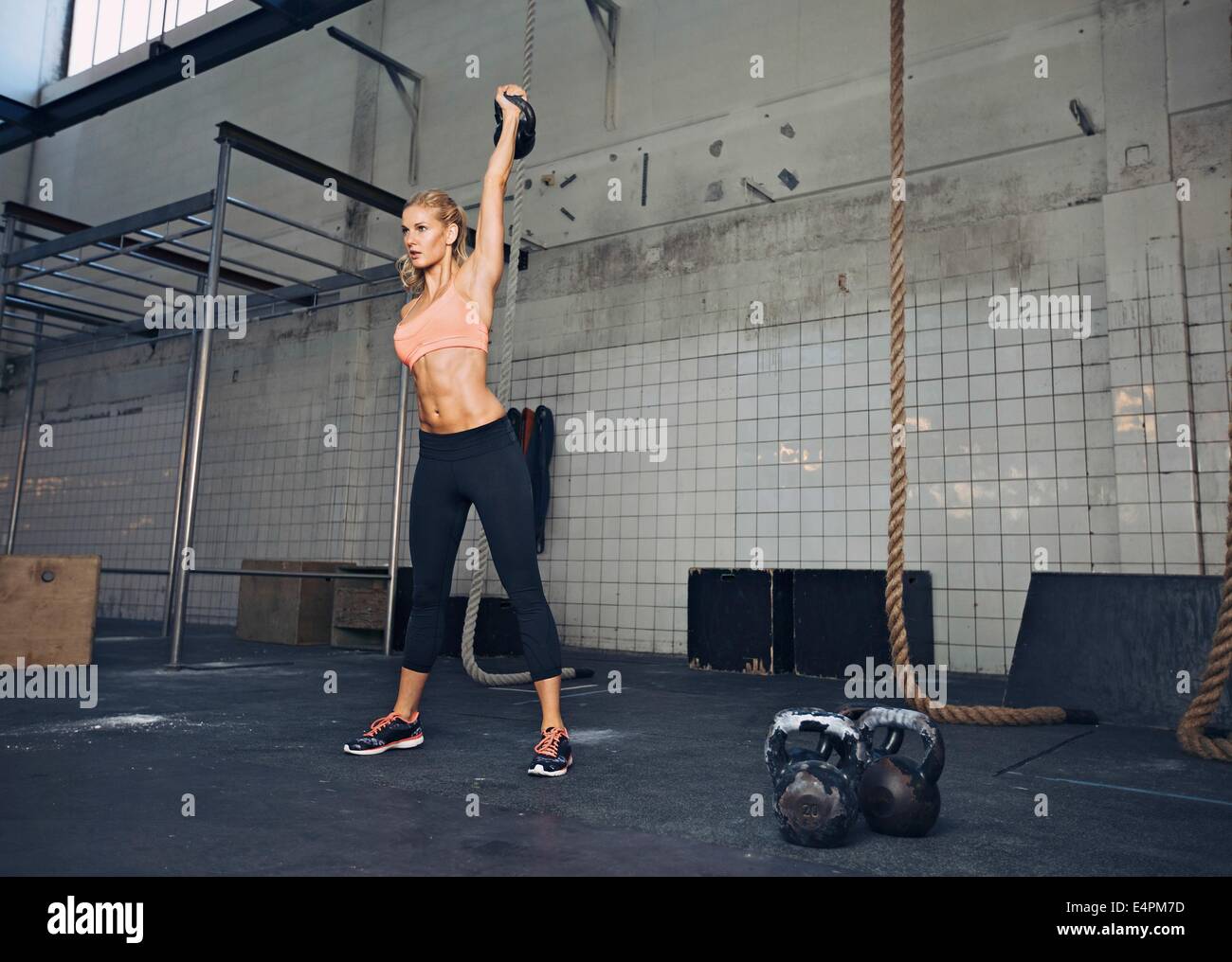 Woman lifting weights hi-res stock photography and images - Alamy