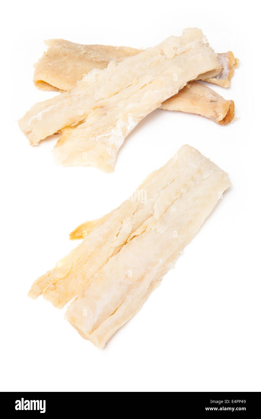 Pieces of salt cod fish isolated on a white studio background Stock ...